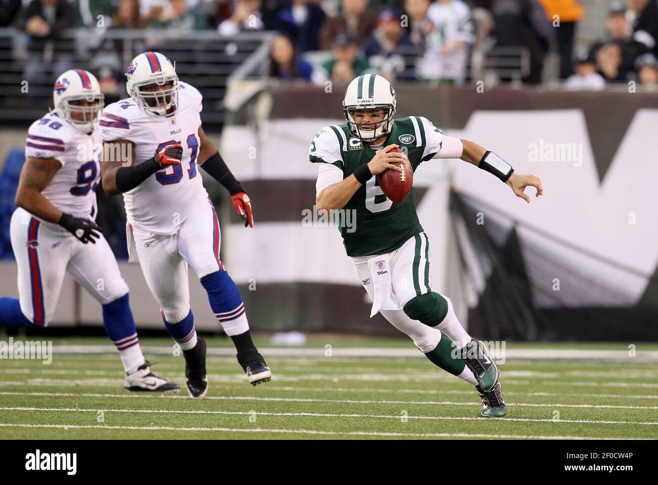 Mark Sanchez of the New York Jets runs the ball on a keeper against the ...