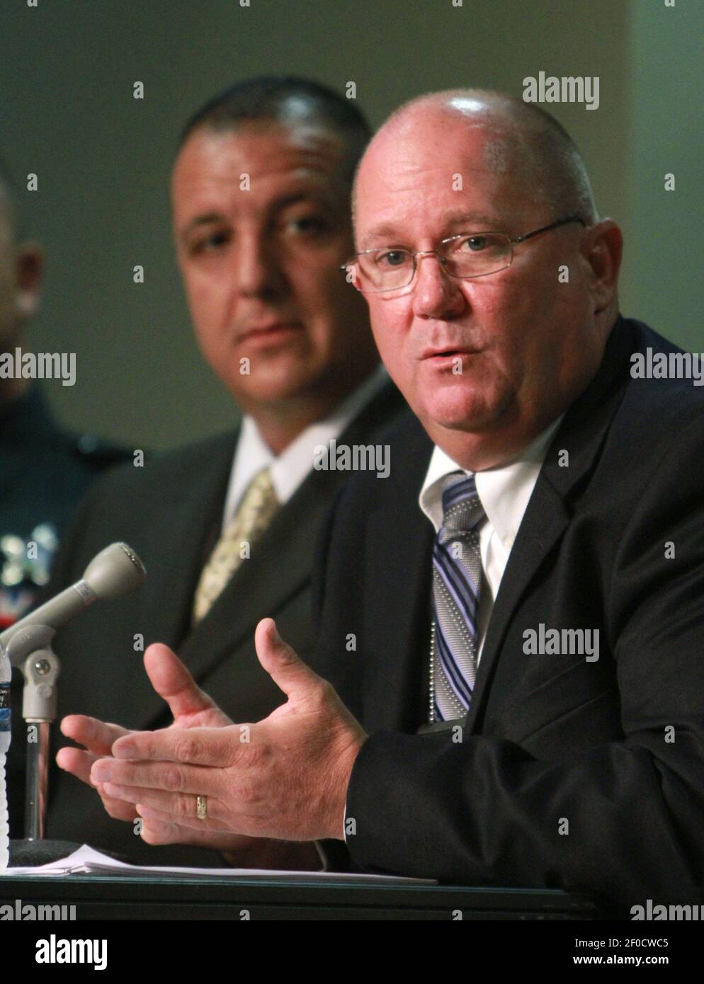 Orange County Sheriff's homicide detective Sgt. John Allen answers a ...