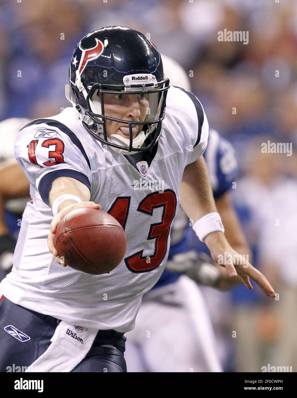 Houston Texans quarterback T.J. Yates (13) hands the ball off in the ...