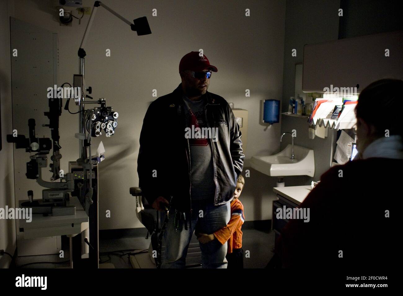 James Dahan, of Lisle, center, stands with his son, Kalel, 4, after ...