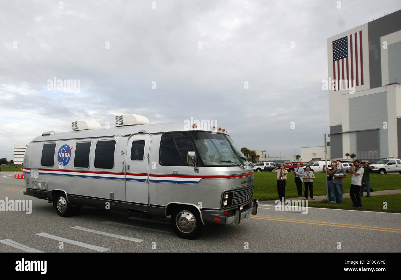 The Astrovan carries the astronauts past the VAB to the launch pad to ...