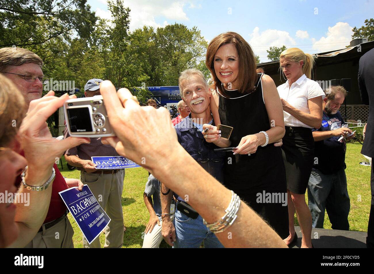 Presidential hopeful Michele Bachmann poses with Neil Derrick at a ...