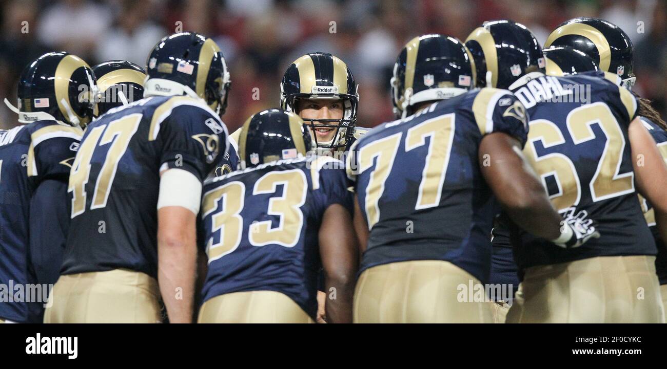 St. Louis Rams quarterback Sam Bradford gives his teammates the play in ...