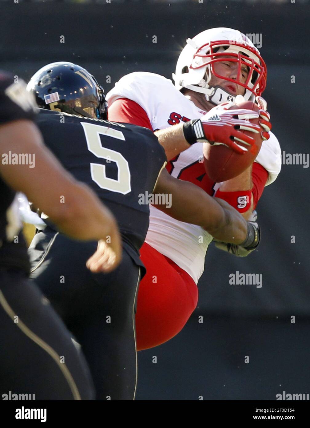 North Carolina State's George Bryan (84) pulls in a one-handed ...
