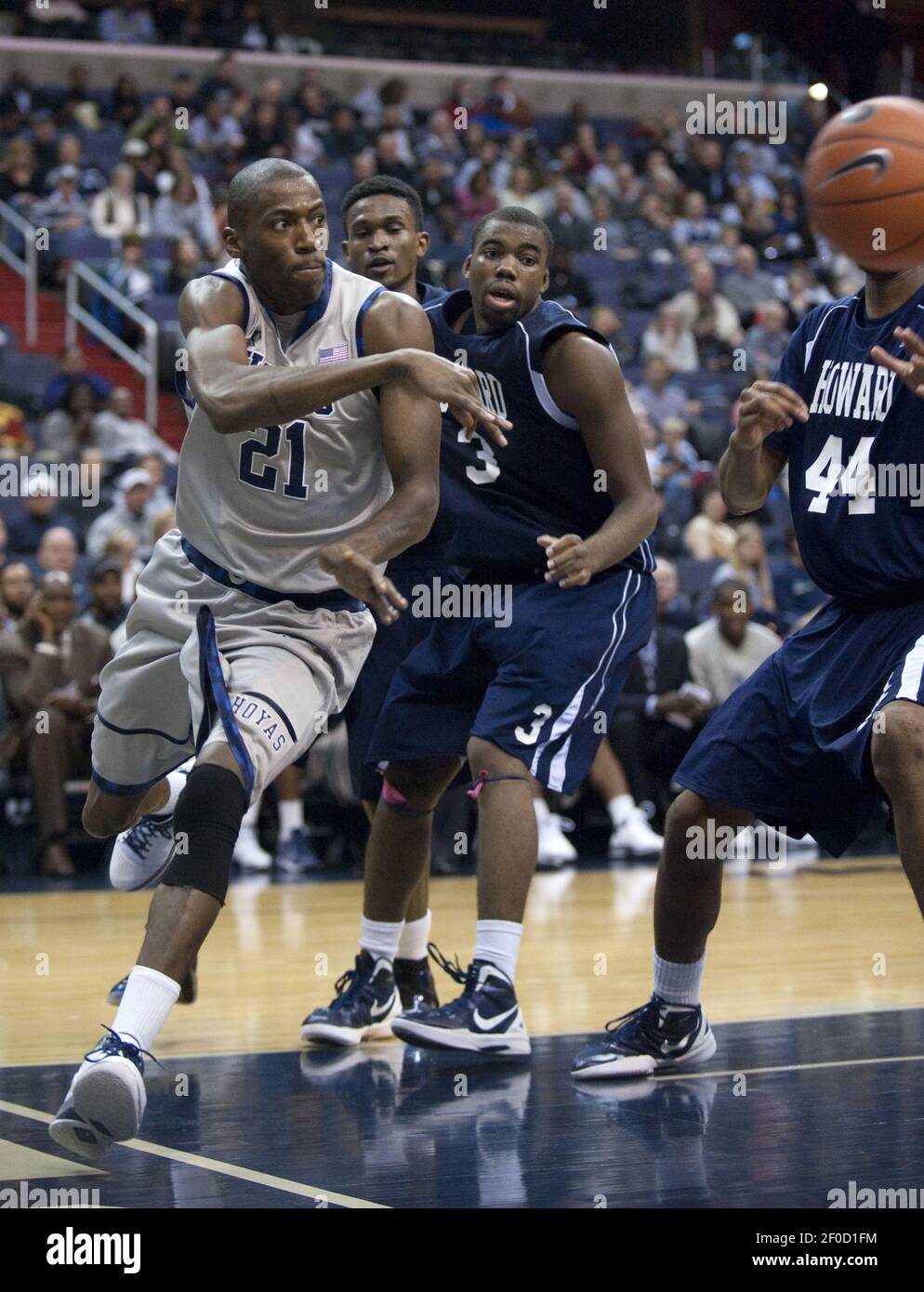Georgetown guard Jason Clark (21) dishes the ball off along the ...