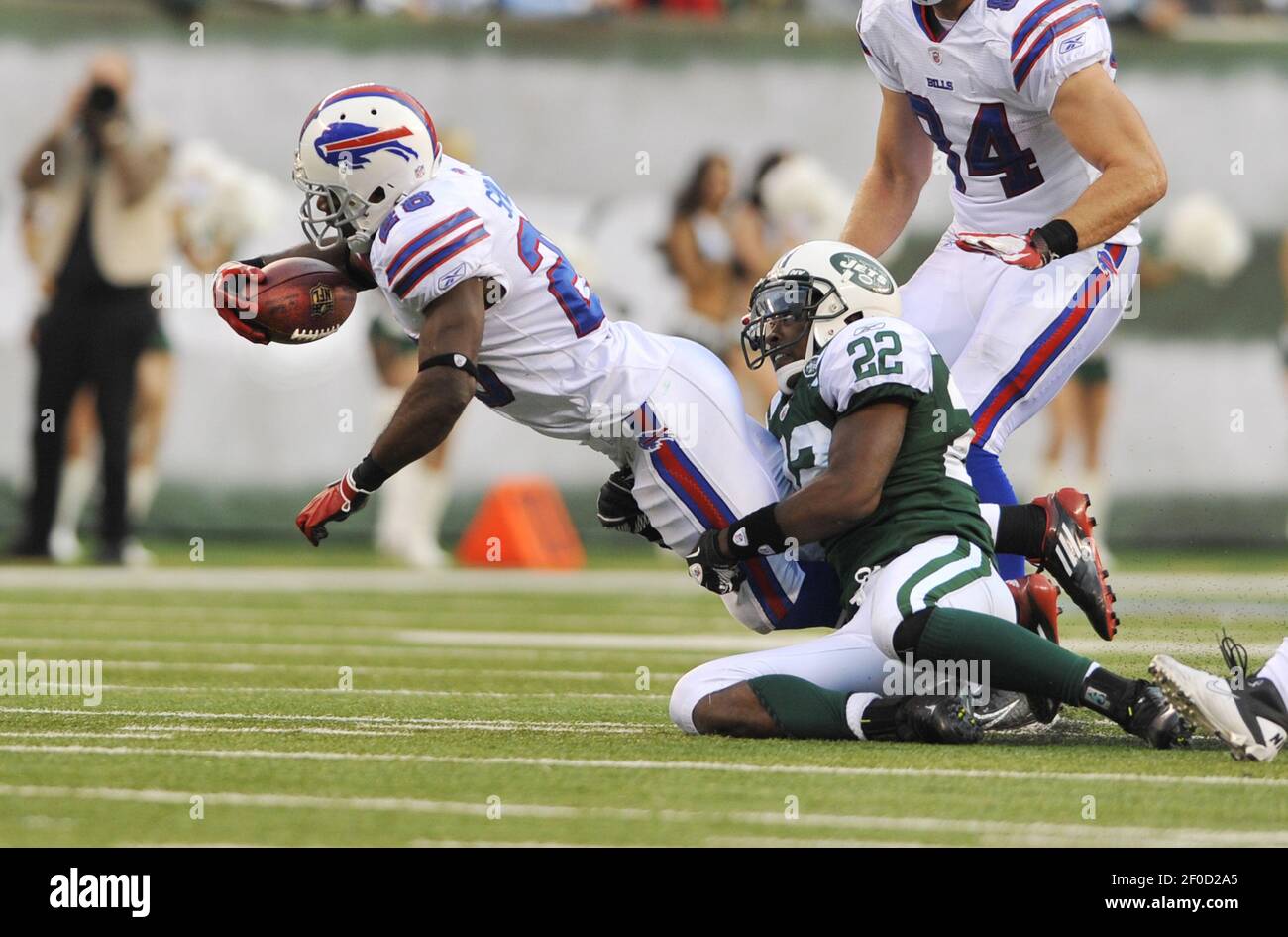 Brodney Pool of the New York Jets brings down C.J. Spiller of the ...