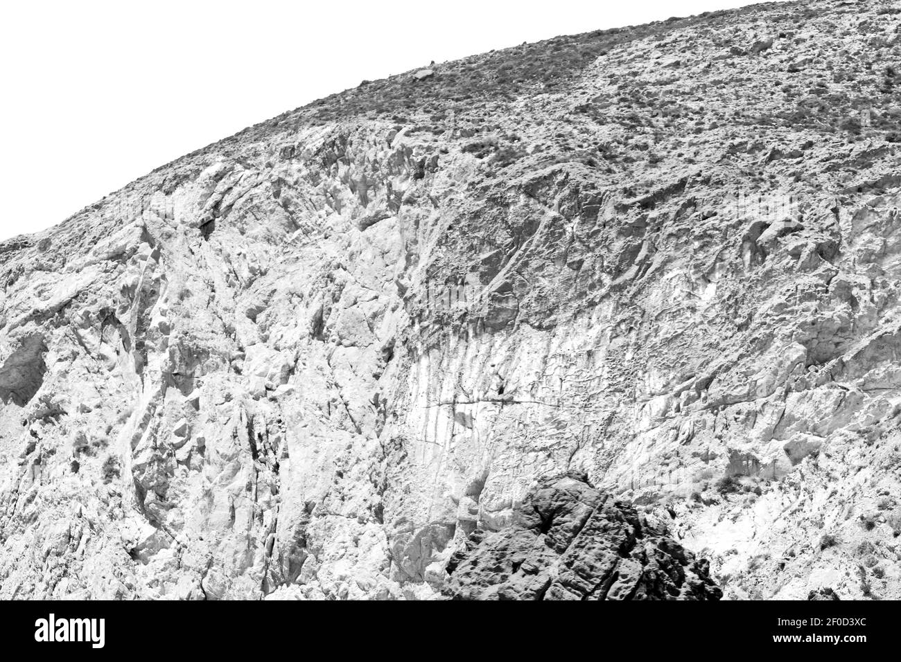 Rock alone in the sky santorini europe greece and dry bush Stock Photo ...