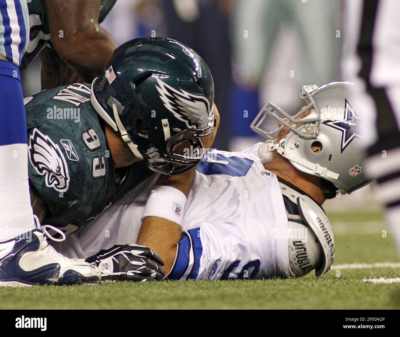 Dallas Cowboys quarterback Tony Romo (9) is slow to get up after ...