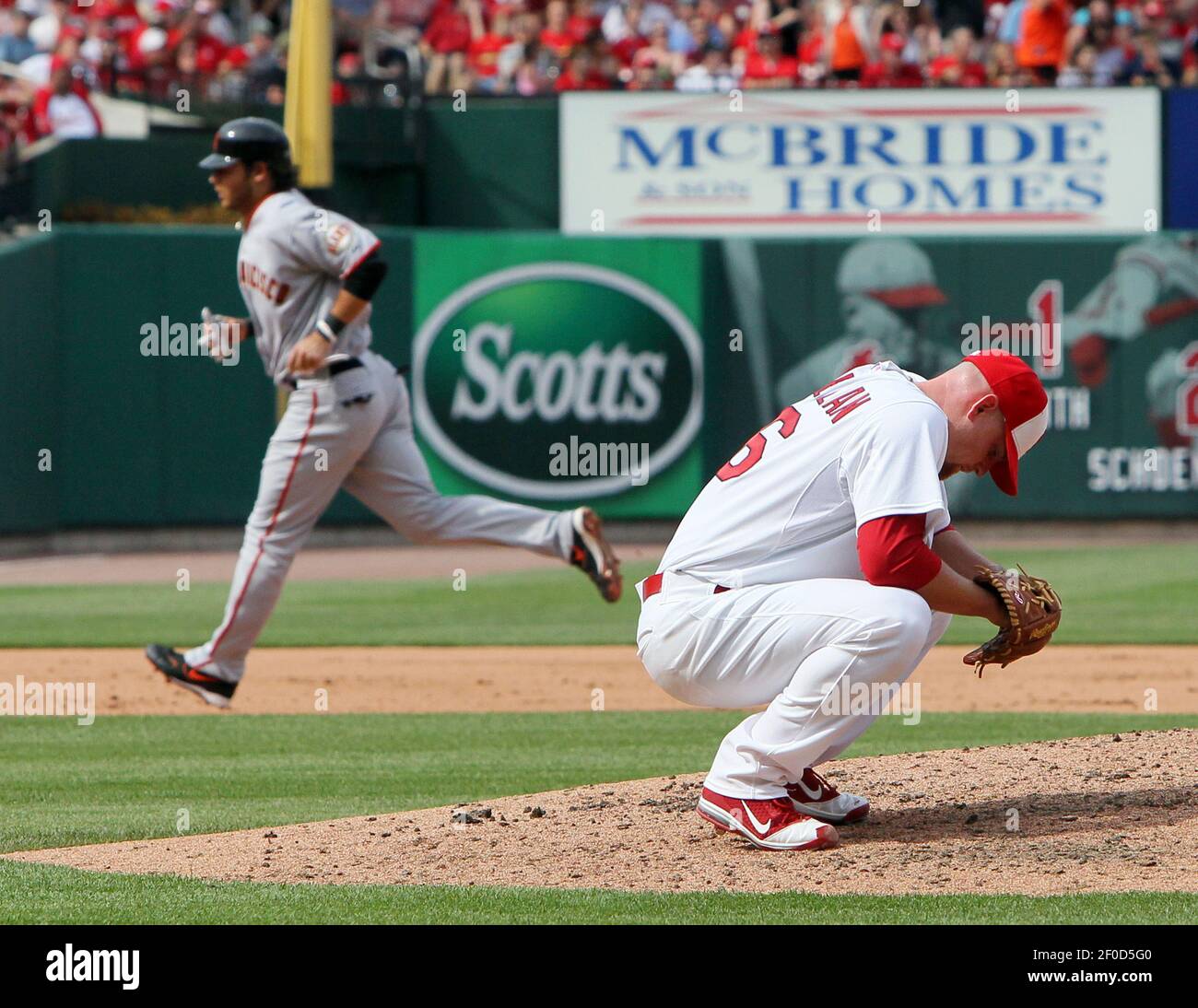 St. Louis Cardinals pitcher Kyle McClellan reacts after giving up a ...