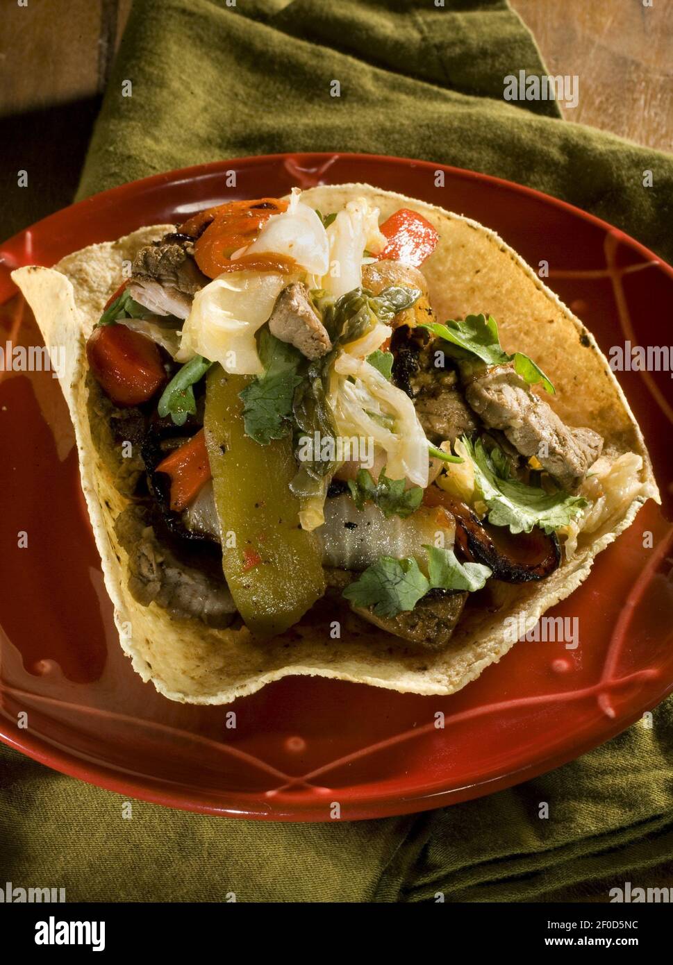 Korean-style grilled beef and vegetables on crisp tortillas make a ...