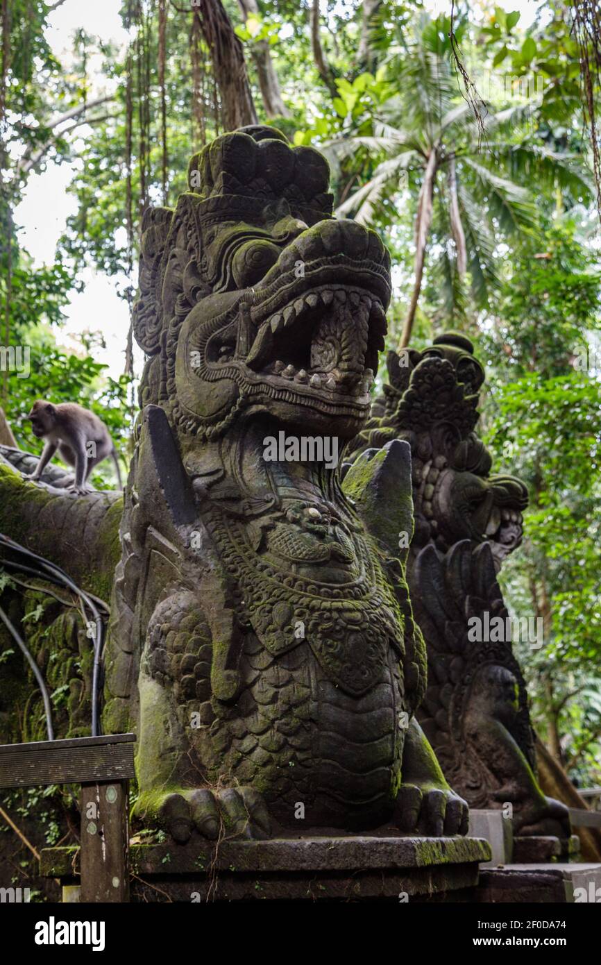 Mossy statues at Mandala Suci Wenara Wana or Monkey Forest Ubud, Bali ...