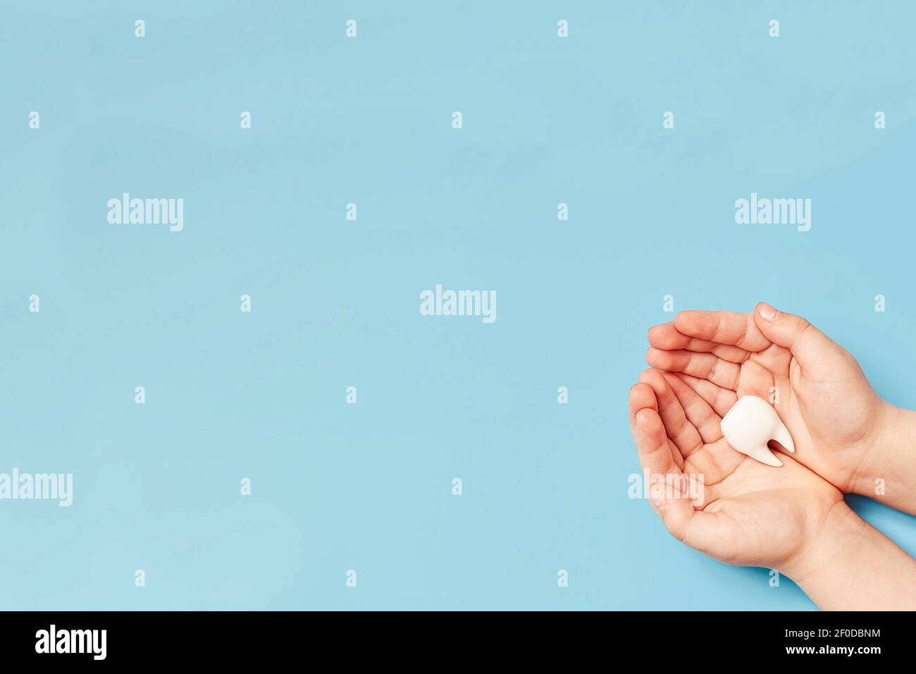 Hands holding a tooth, healthcare, love, family dentist, world day of ...