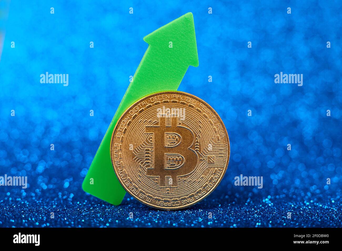 Bitcoins with Candle stick graph chart and digital background.Golden ...