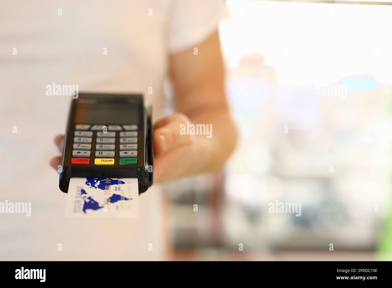 Male hand holding pos terminal with credit bank card closeup Stock ...
