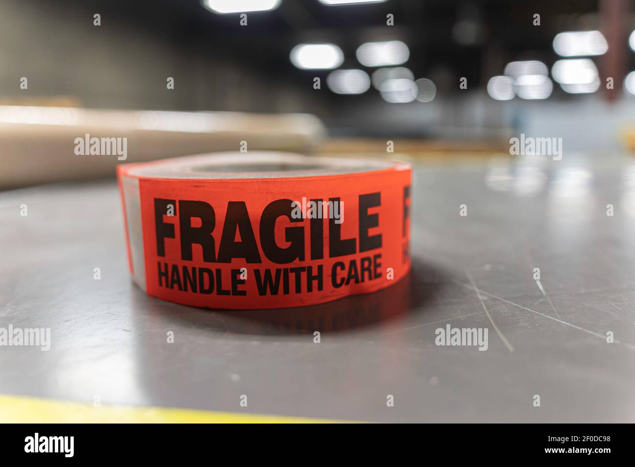 Orange colored shipping label for delivering fragile items Stock Photo ...