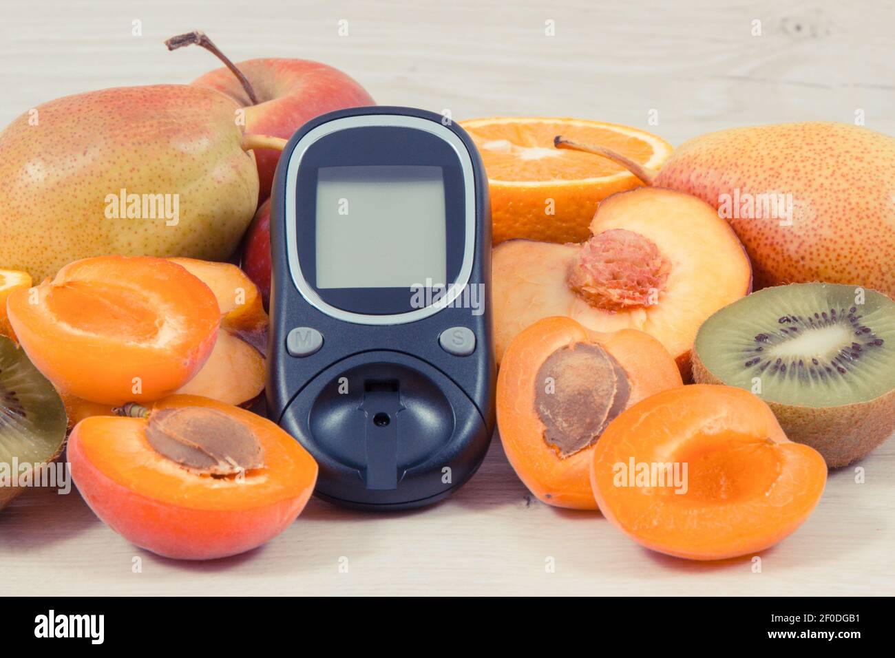 Glucometer for checking sugar level and fresh healthy nutritious food ...