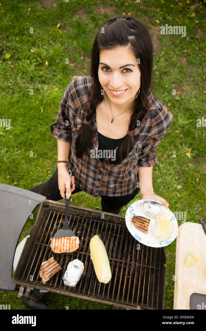Pretty Woman Smiling Cooking Steaks Barbecue Backyard Food Grill Stock ...