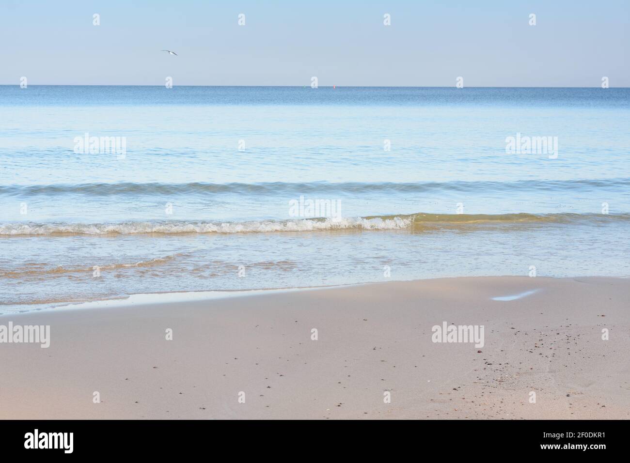 Evening beach on seashore. Soft sand and surf. Calm, summer mood. Beach ...