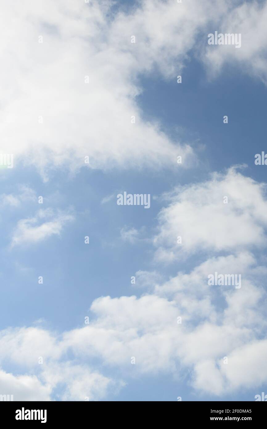 Spring bright blue sky with clouds. Abstract background, copy space ...