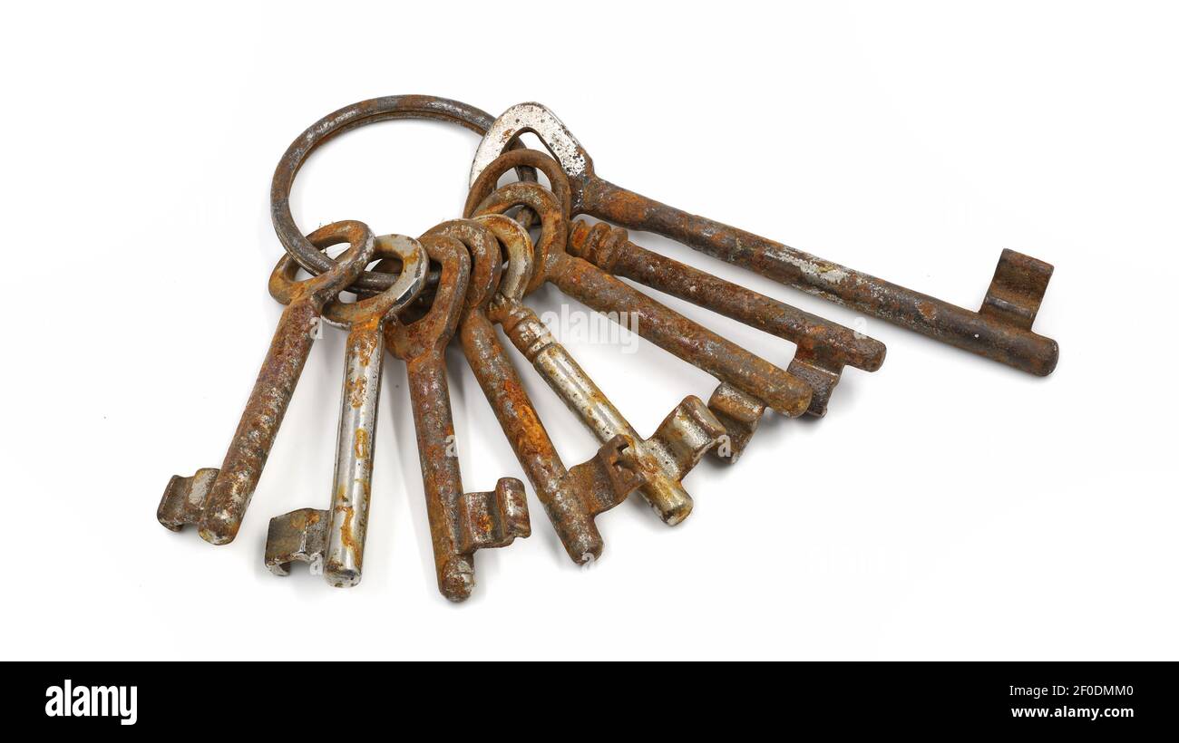 bunch of old rusty keys on white background Stock Photo - Alamy