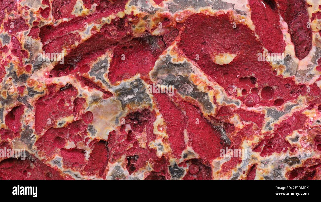 Untreated surface of a red agate, natural quartz stone texture, mineral ...