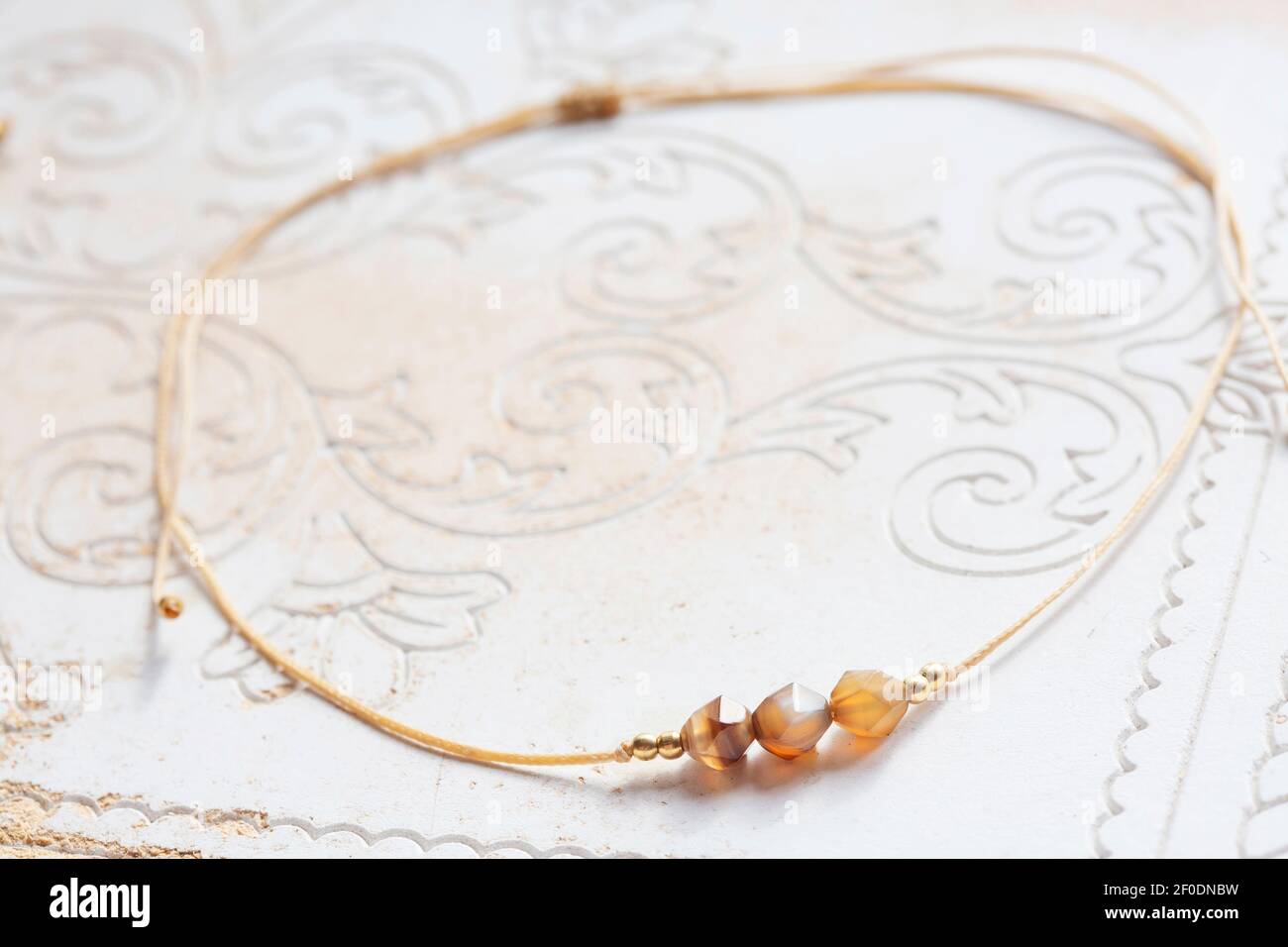 Agate mineral stone bead string jewelry bracelet on white background ...