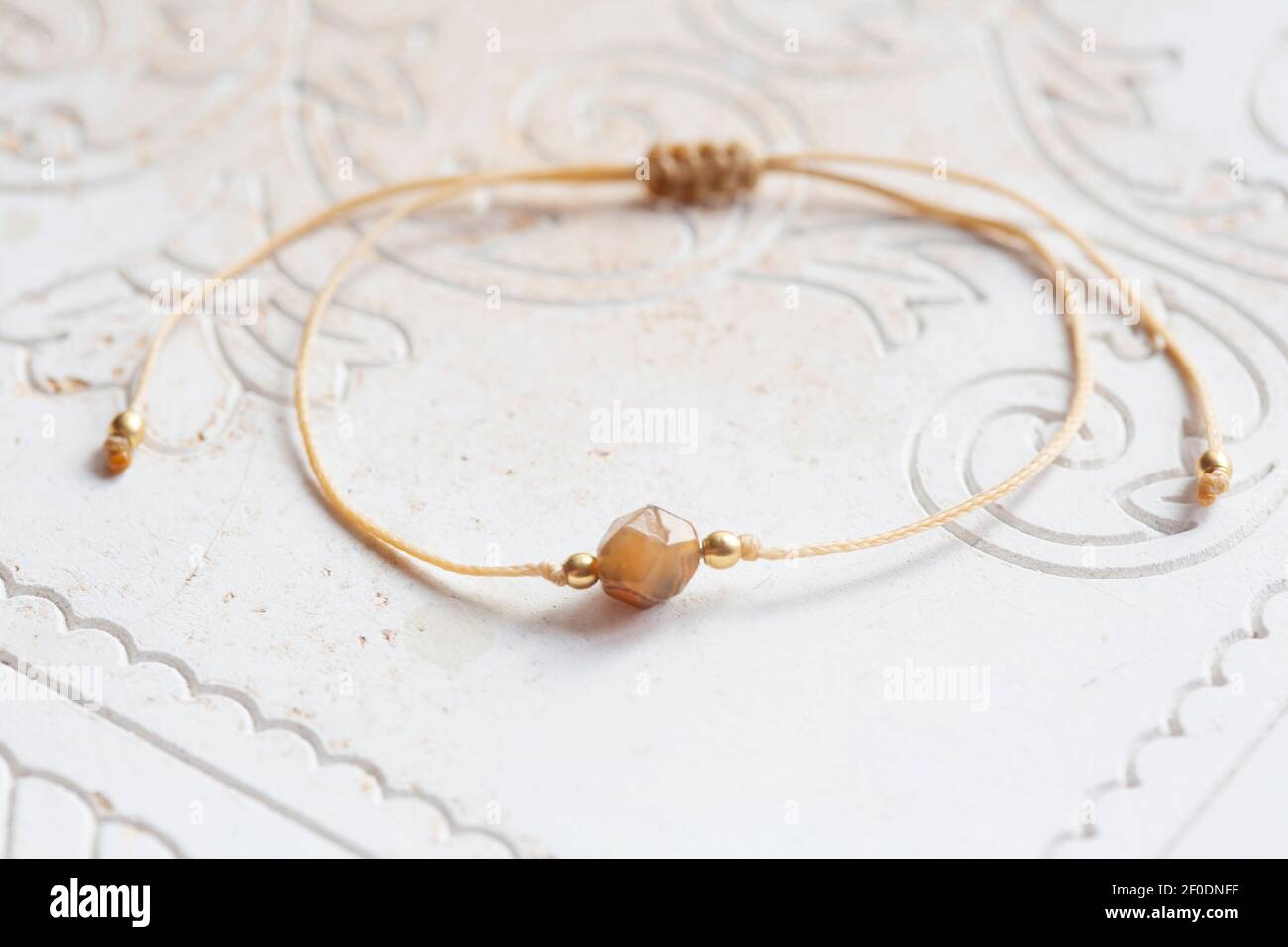 Agate mineral stone bead string jewelry bracelet on white background ...