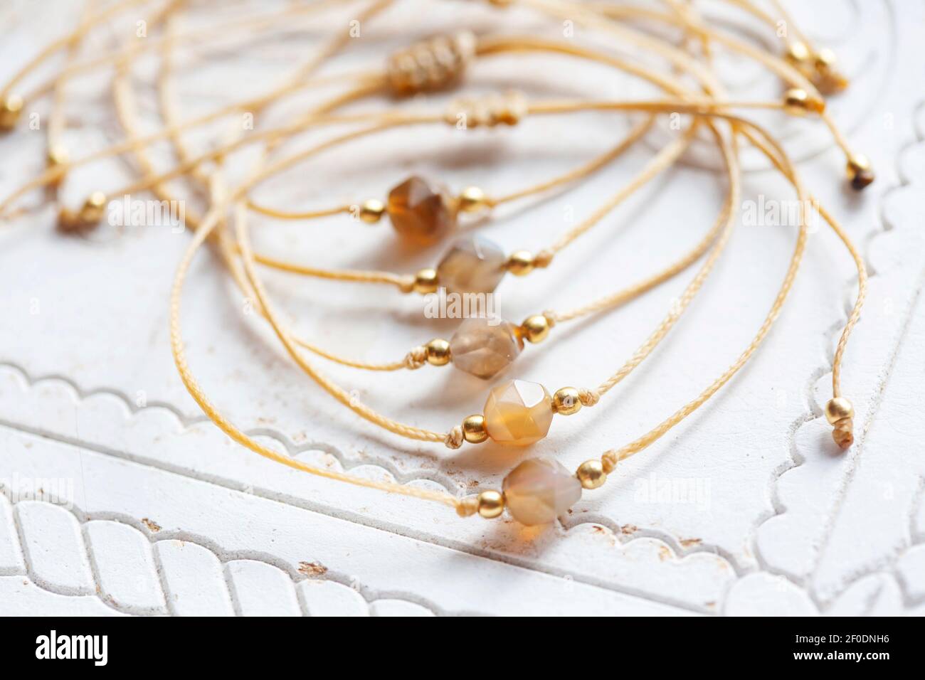 Agate mineral stone bead string jewelry bracelet on white background ...