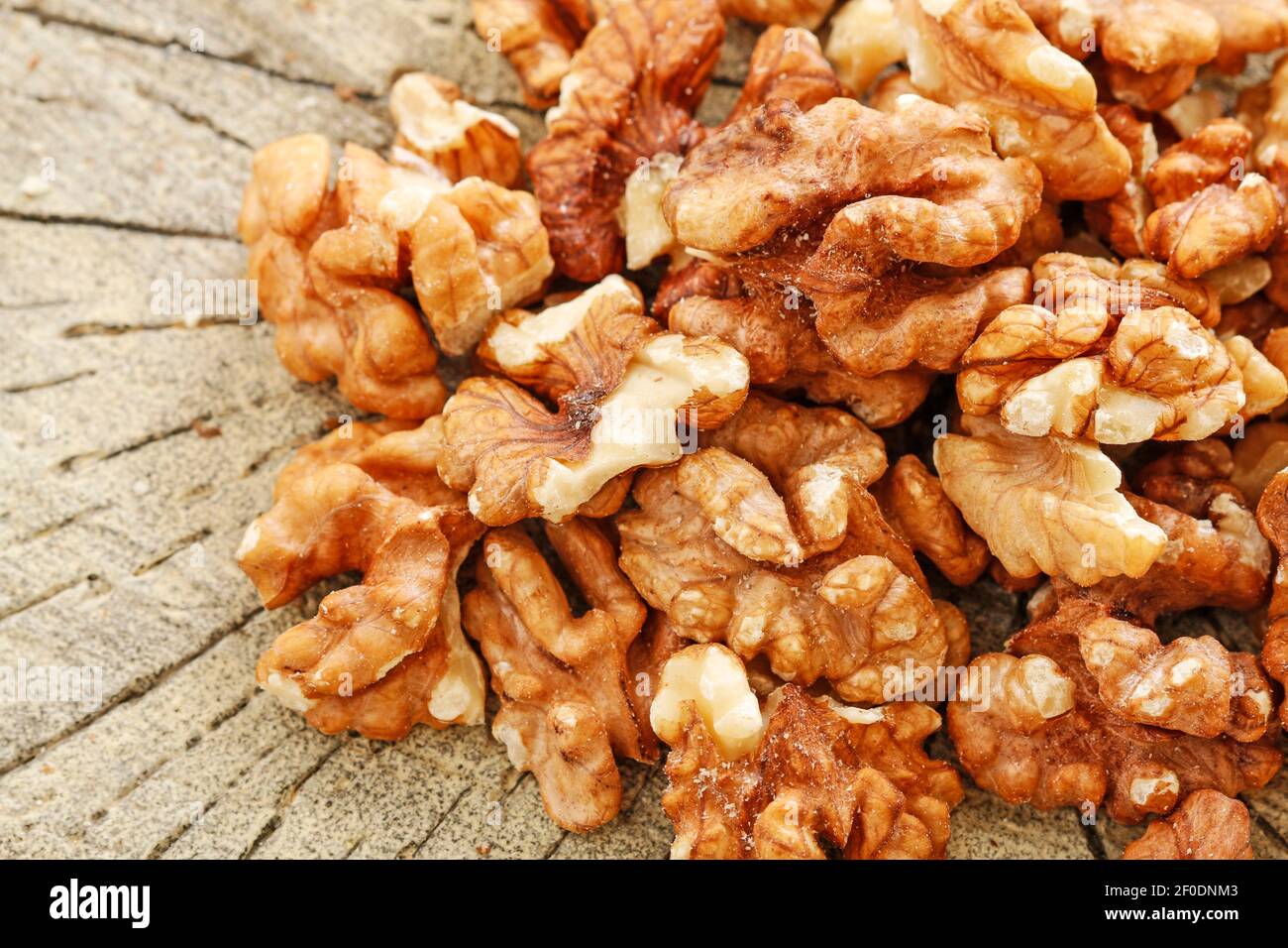 Walnuts on brown wooden background. Healthy food Stock Photo - Alamy