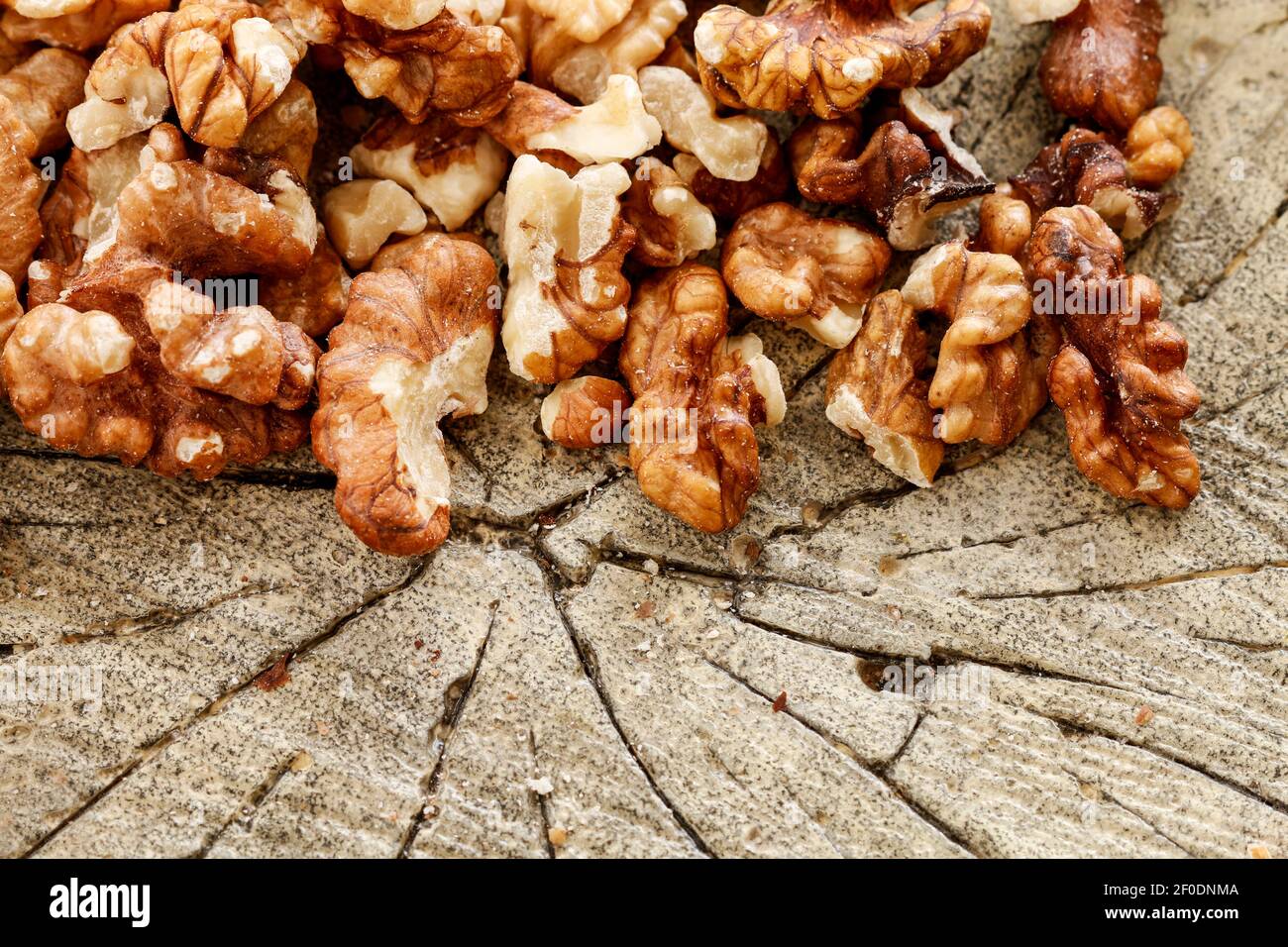 Walnuts on brown wooden background. Healthy food Stock Photo - Alamy