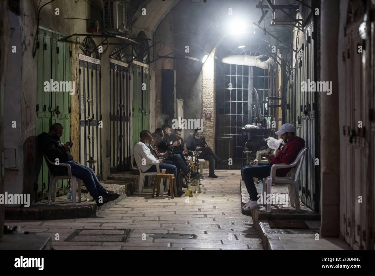 Palestinians smoking hookah pipe as they sit in a coffee shop in the ...