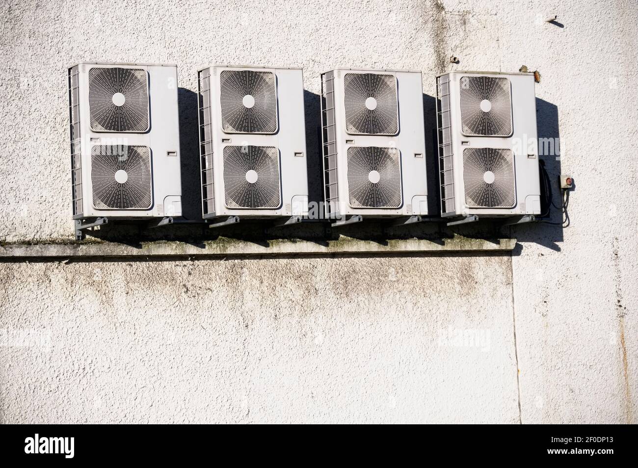 Condenser units for air conditioning system wall mounted outdoors Stock ...