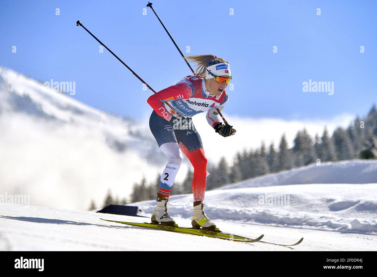 Therese JOHAUG (NOR), in front of a mountain panorama. Action ...