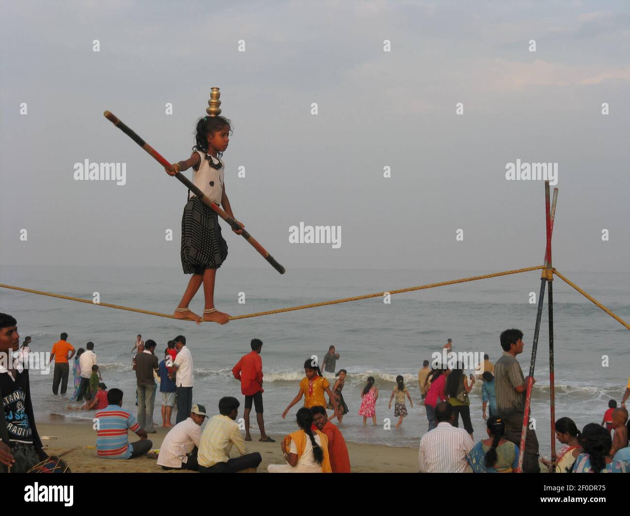 child rope walker artist walking on rope holding a balancing stick ...
