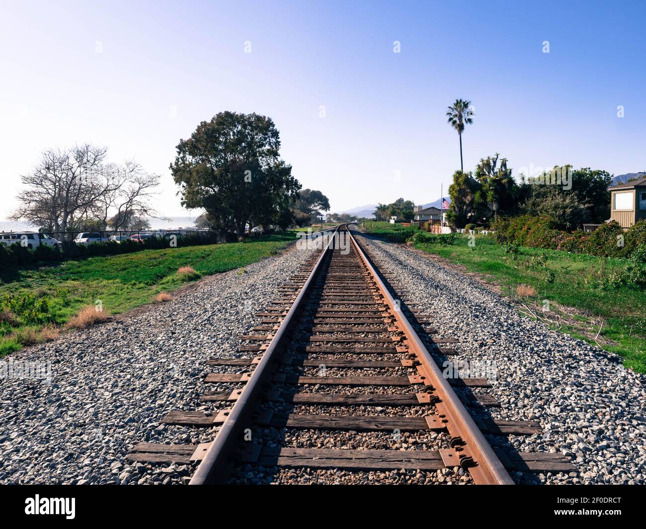 Railroad track along the coast in Carpinteria, California with palm ...