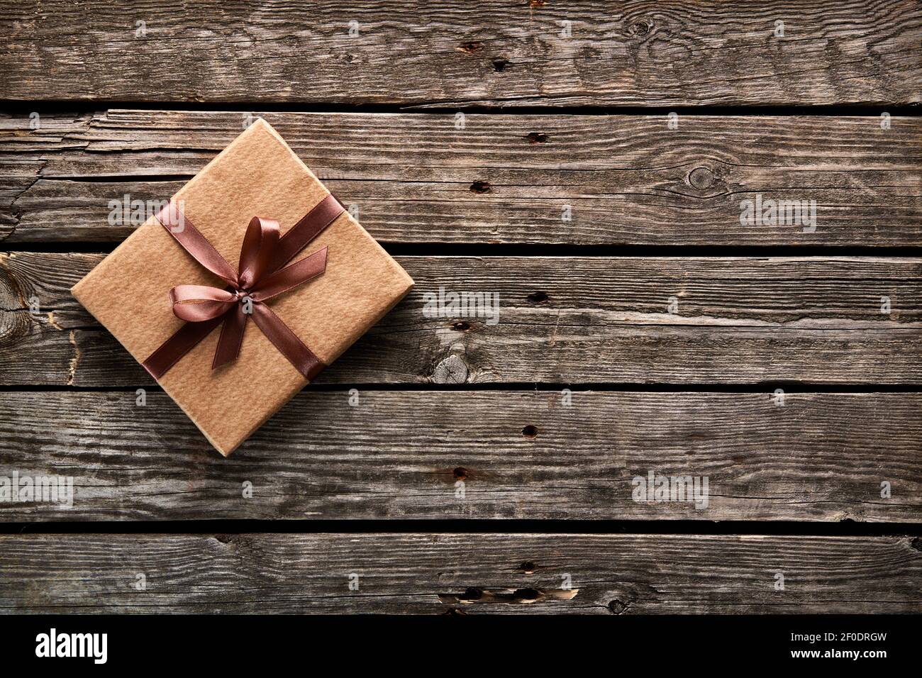 Vintage gift box on wooden background Stock Photo - Alamy