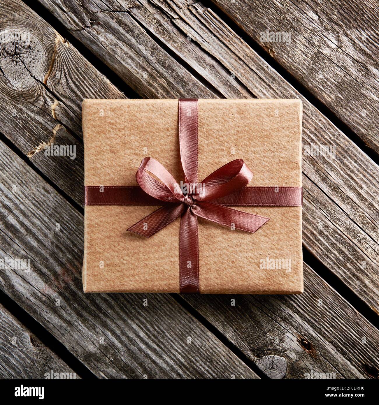 Vintage gift box on wooden background Stock Photo - Alamy
