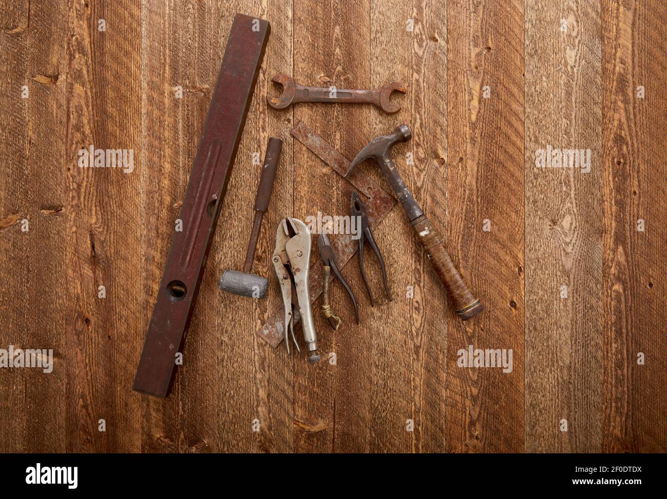 old rusty woodworking tools on distressed bard wood floor boards Stock ...