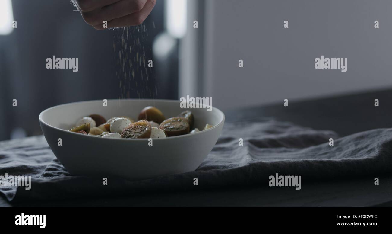 put seasoning fettuccine in white bowl on linen cloth, wide photo Stock ...