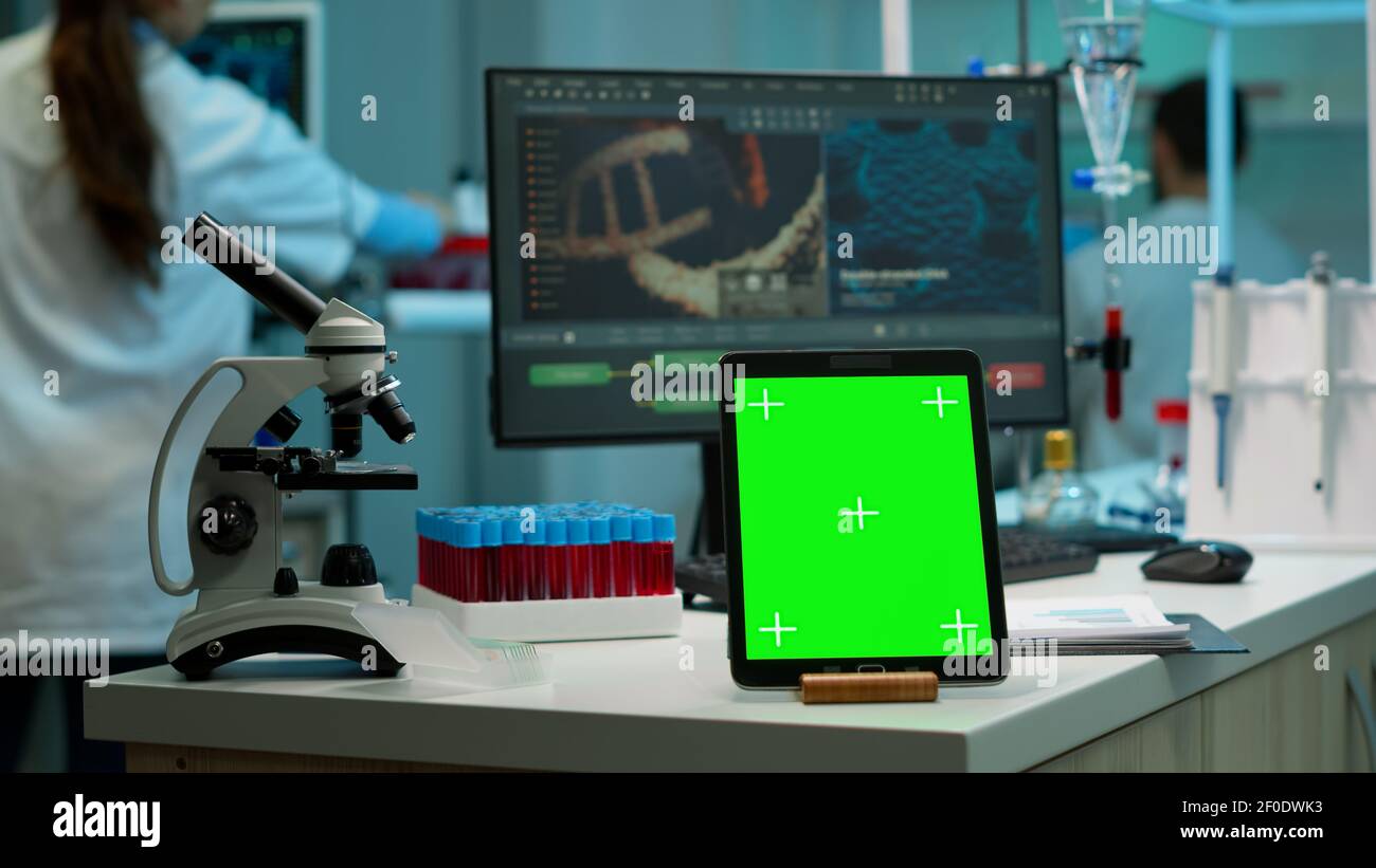 Scientist Standing At Monitor In Background Analysing Virus Evolution