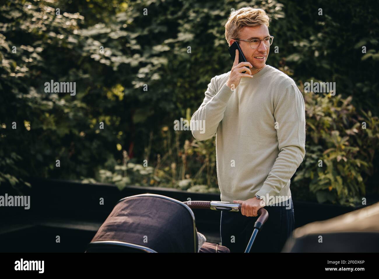 Dad pushing pram hi-res stock photography and images - Alamy