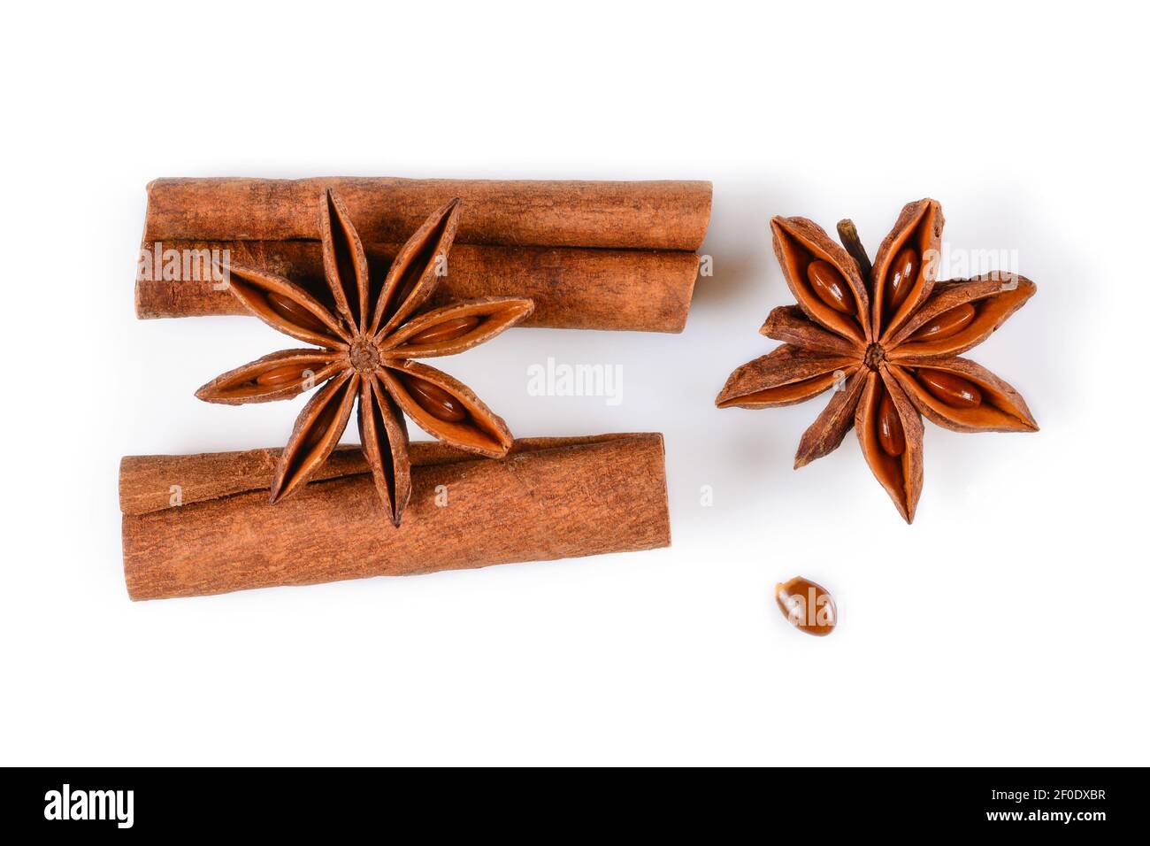 Anise star spice with seeds and two cinnamon sticks. Close up macro ...