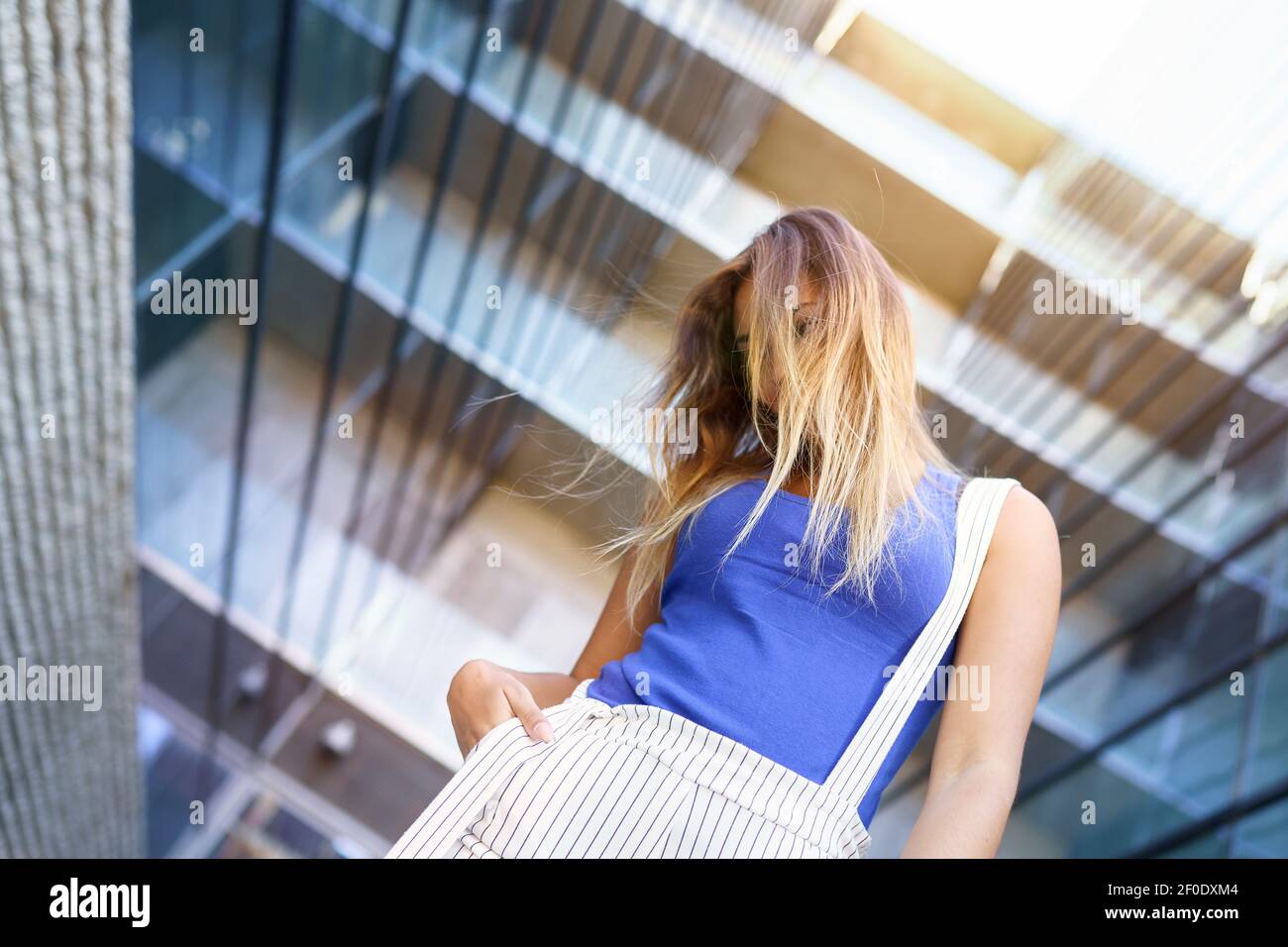 View from above of young girl moving her hair wild Stock Photo - Alamy