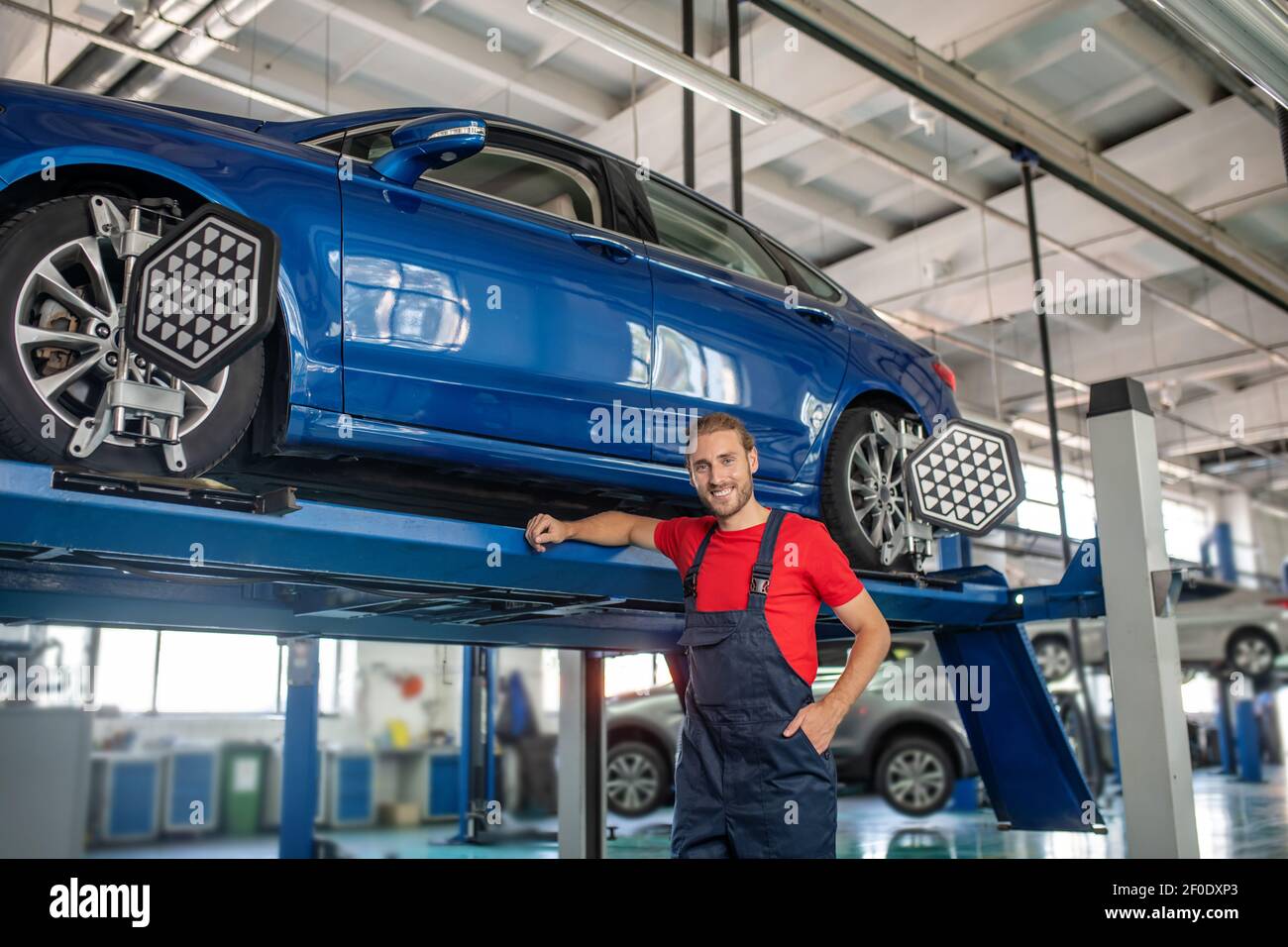 Mechanic standing near car hi-res stock photography and images - Alamy