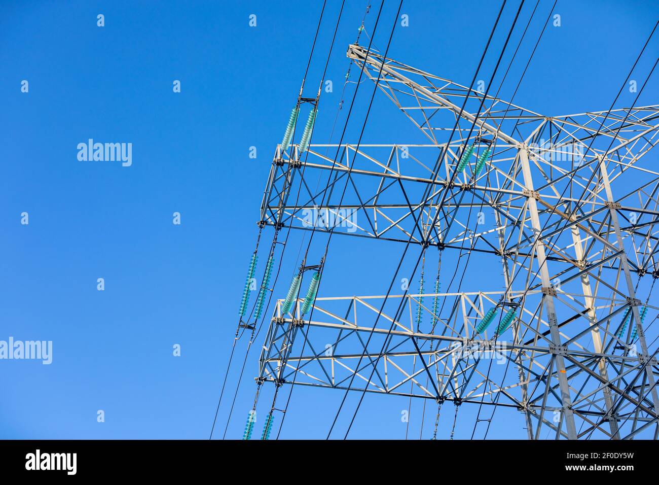 New large mast of an air power line close up, high voltage electricity ...