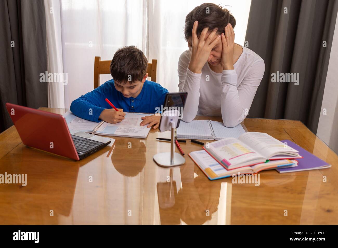 parents teaching kids at home, home school education, Mother helping ...