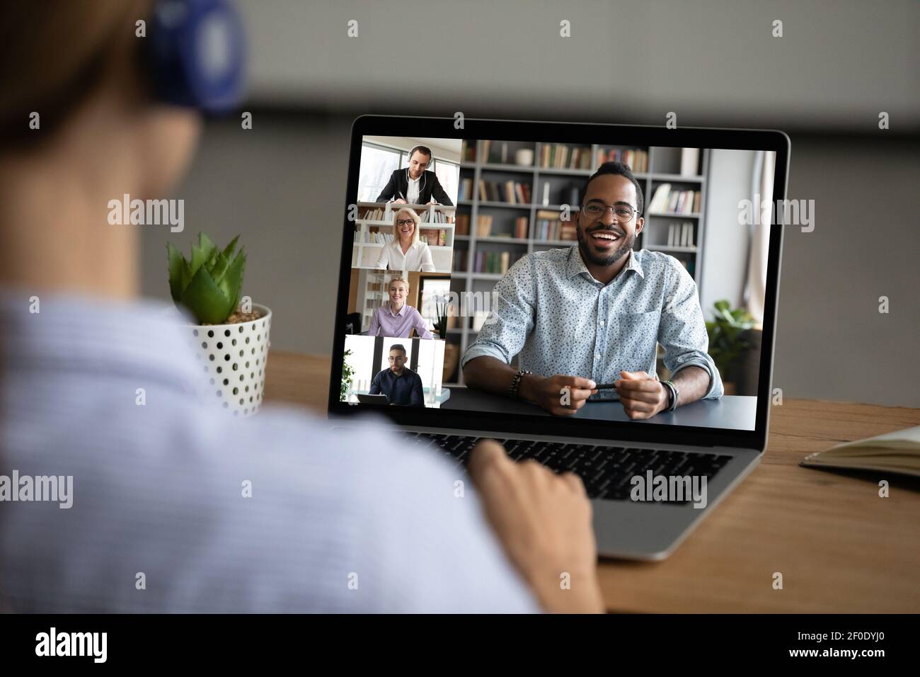 Female employee talk on video call with diverse colleagues Stock Photo ...