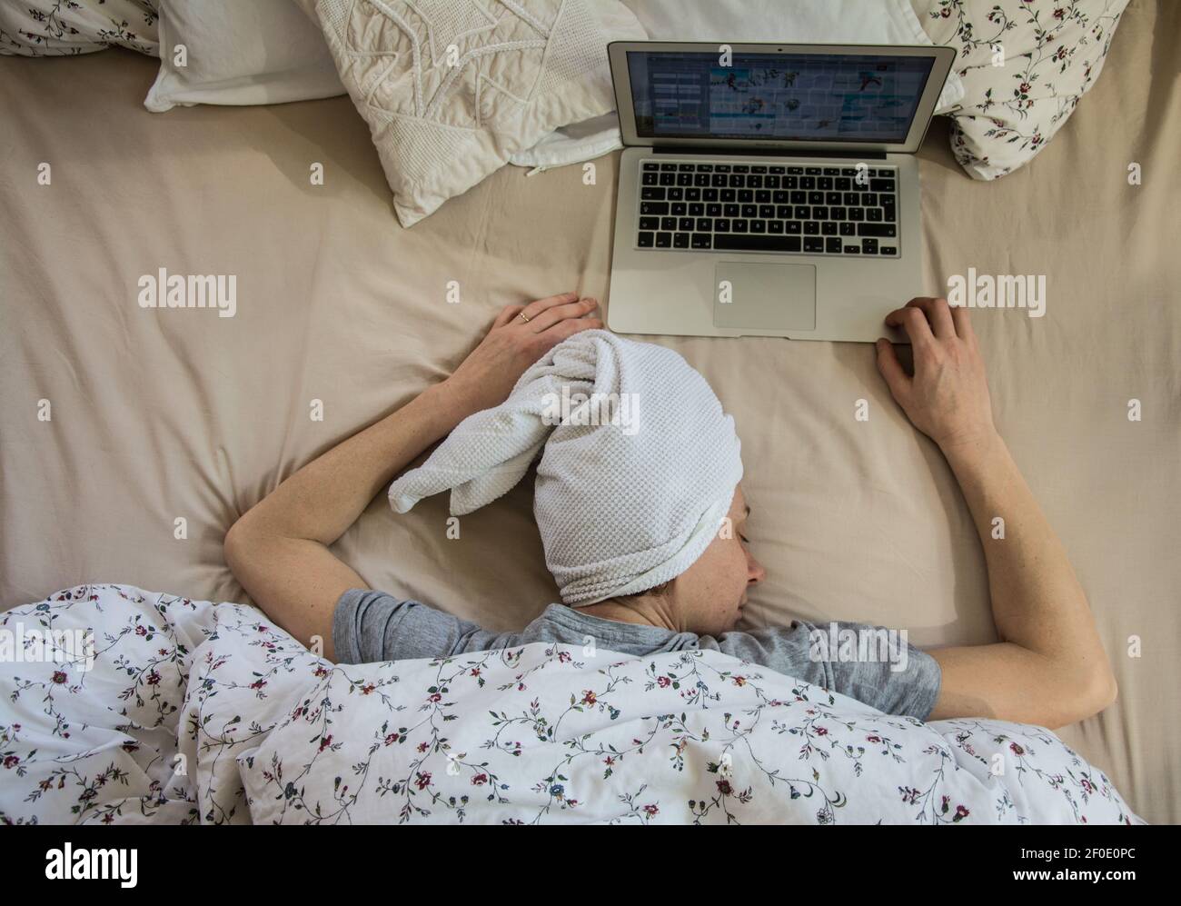 Woman in bed with laptop using internet in online service Stock Photo ...
