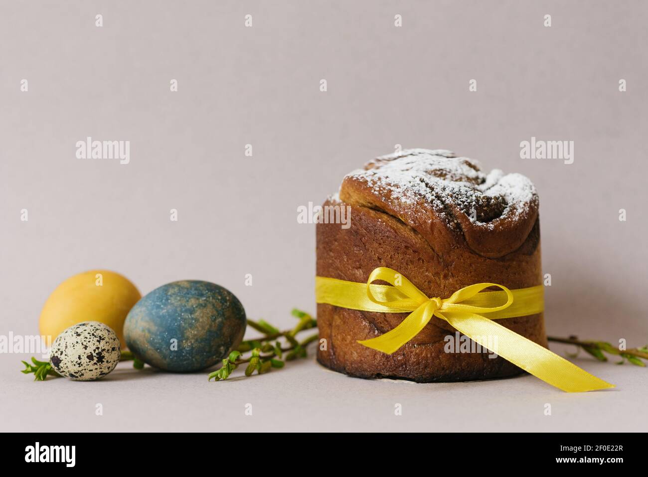 Easter cakes (Orthodox Easter cake), eggs and forsythia branches. The ...