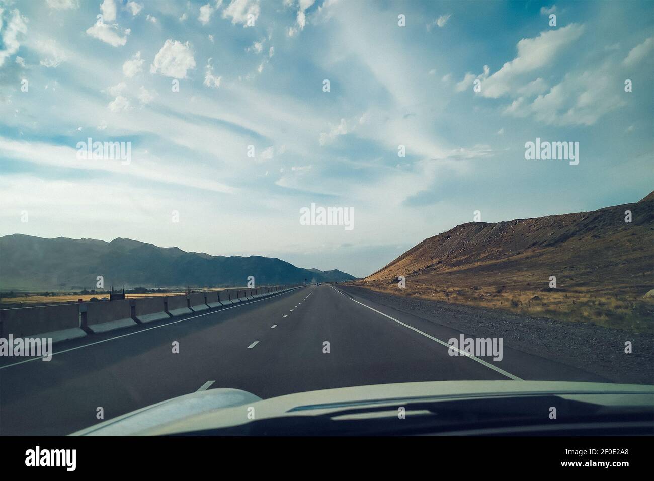 Pov highway drive through mountains hi-res stock photography and images ...